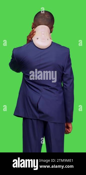 Vertical video: Back view of young adult with fracture using cervical ...