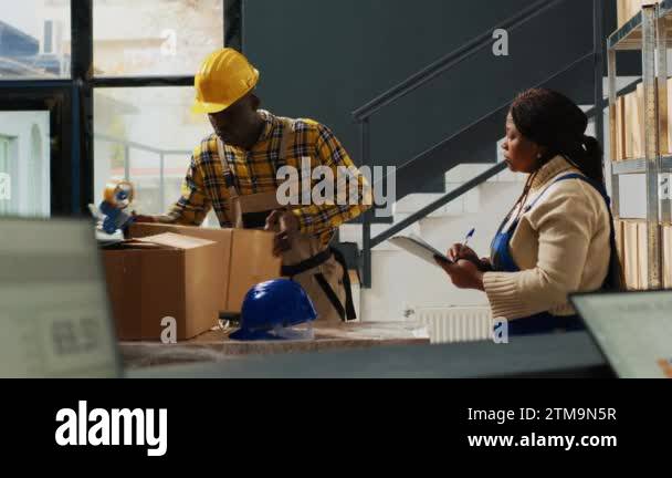 Production team working on logistics and quality control with stock ...