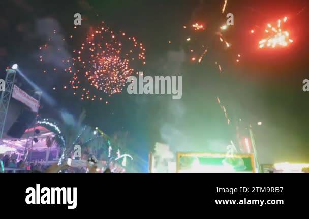 Crowd of people flow in countdown to next year with fireworks Stock ...