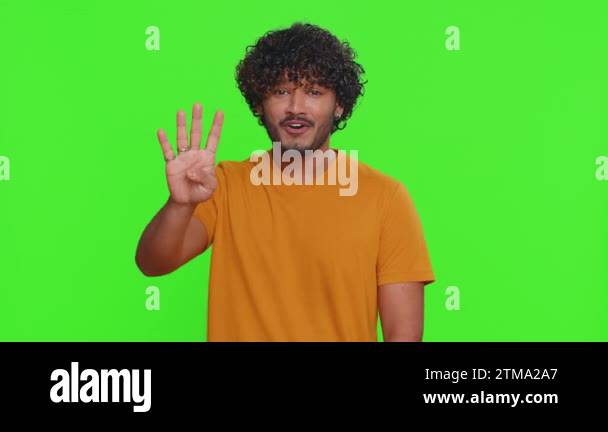 Countdown to holiday birthday celebration. Young indian man counting in ...