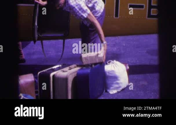 baggage handler loading the luggage compartment of an airplane Stock ...