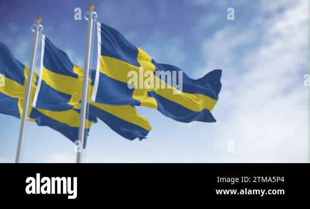 Three national flags of Sweden waving on a clear day. Yellow Nordic ...