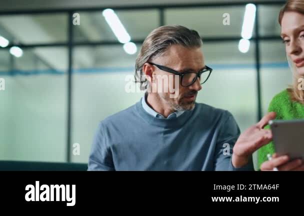 Two partners speaking together at meeting room close up. Business ...