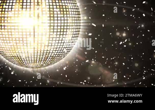 Animation of rotating mirror disco ball over falling confetti, lens ...