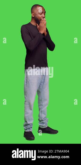 Vertical video: Side view of young adult feeling tired and yawning on ...