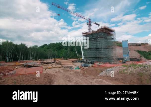 Building site with construction tower crane and materials for road ...