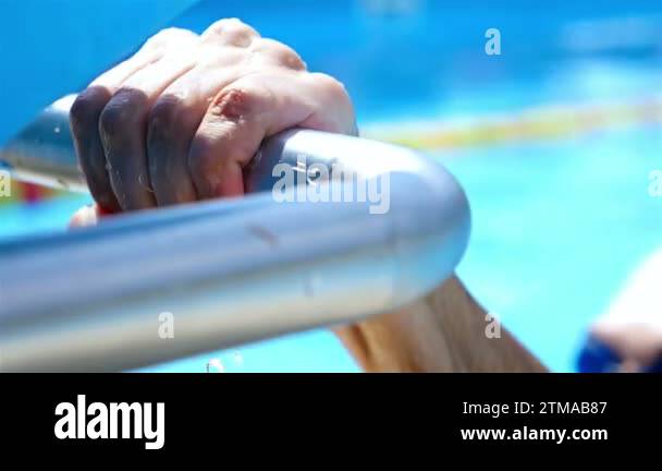 Swimmer jump into water during start of swimming on back in an open air ...