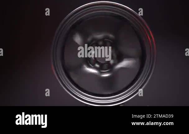 sporty metallic gray car rims extended illuminated by red light long ...