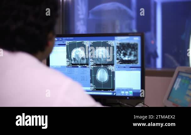 Computed tomography of the brain. The doctor examines the result of the ...