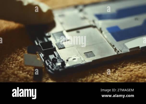 Macro view of smartphone laying on a surface. Someone mad breaking the ...