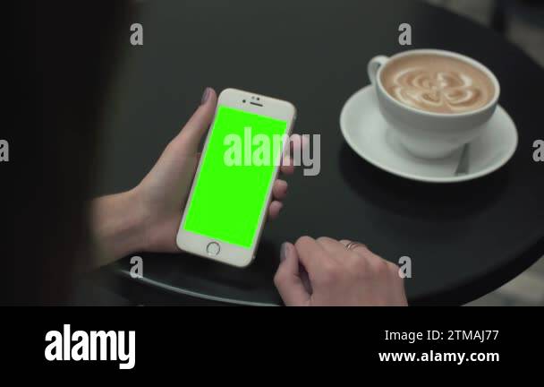 Woman Using a Mobile Phone with Green Screen Stock Video Footage - Alamy