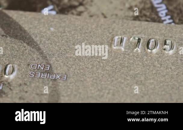 The credit card rotates close up. Plastic bank card spinning in macro ...