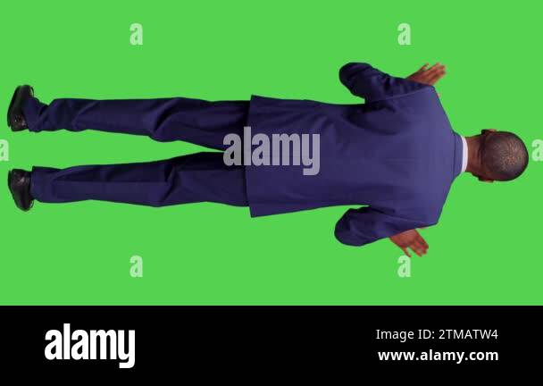 Vertical video: Back view of smiling entrepreneur in suit applauding on ...