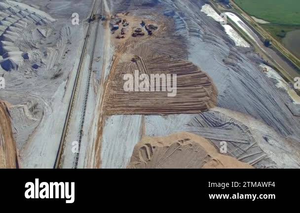 4k areal works above potash mines close up. Artificial mountains ...