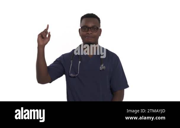 Cheerful African male doctor pointing finger up. Body language concept ...