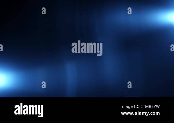Abstract blue optical lens flares light motion animation on dark blue ...