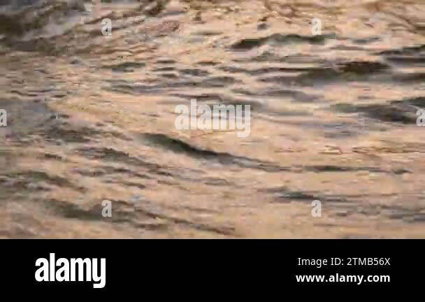 Amazing close up nature texture of running ripple on the water ...