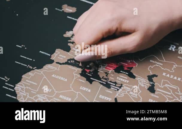 Scratching country of Italy on the Surface of Scratch World Map. Female ...