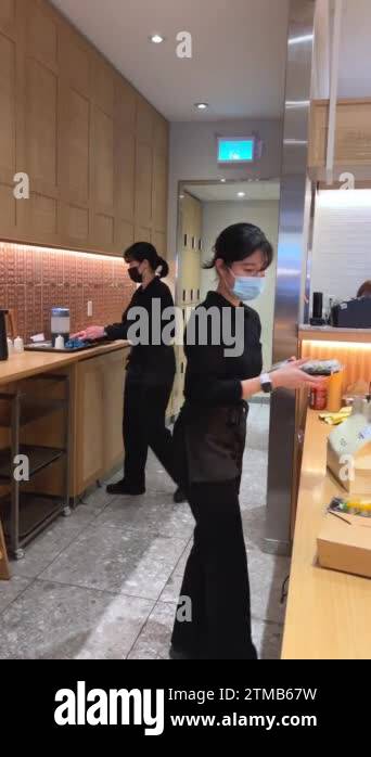 popular sushiya many chefs and waiters waiters deliver takeaway food to order at the tables ...