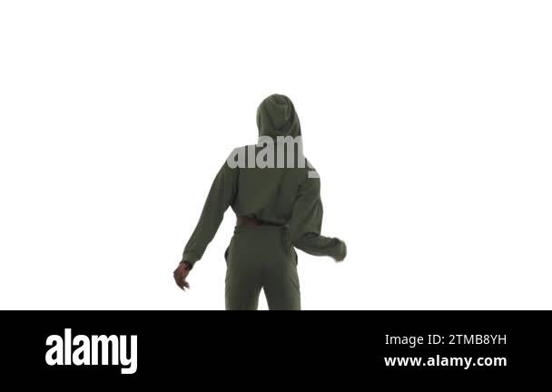 Back view of slim African American woman in hood dancing, intensely ...