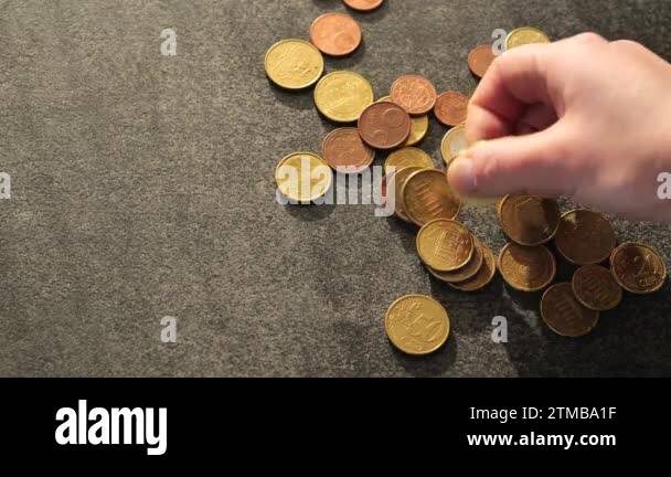 Coin counting. Hand collects euro cents.Slow motion.Lack of money ...
