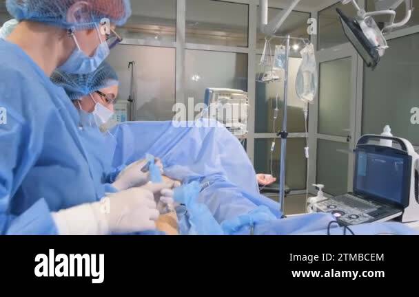 The procedure of the operation in the operating room. A doctor and a ...