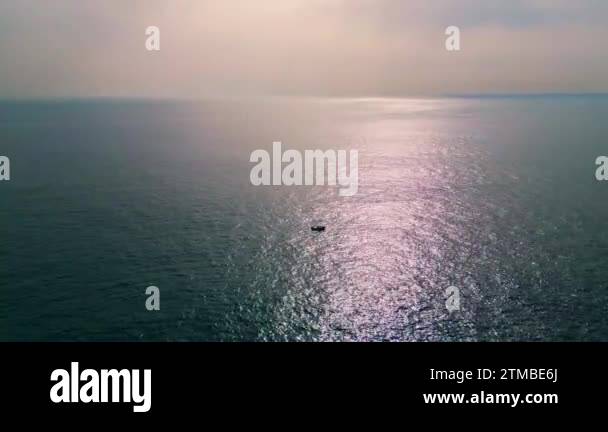Lonely boat floating endless ocean aerial view. Motor yacht sailing ...