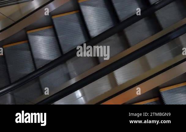 close up view of escalators in modern shopping mall without any people ...