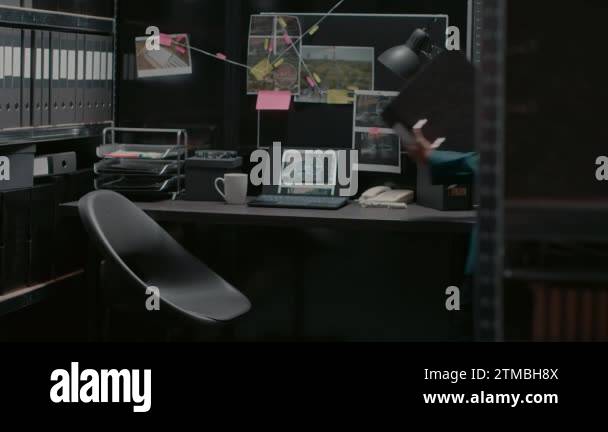 Police investigator examining clues from crime scene, looking at ...