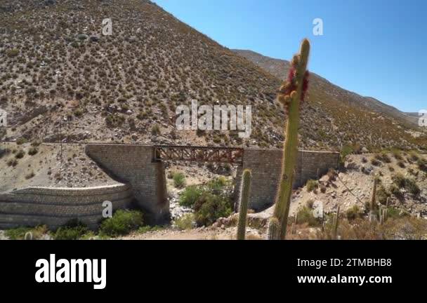 Railway steel space frame bridge leading over a dry river bed in a ...