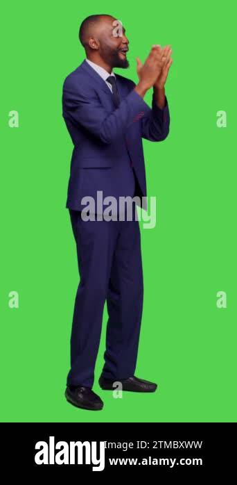 Vertical video: Side view of smiling entrepreneur in suit applauding on ...
