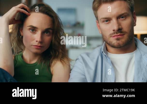 Focused pair staring tv show at home closeup. Calm man hand holding ...