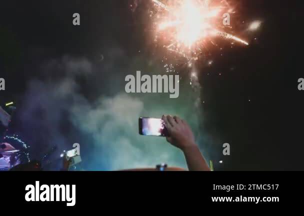 Crowd of people flow in countdown to next year with fireworks Stock ...