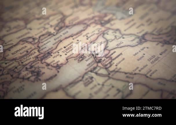 Turkey on a vintage political world map. Slow motion, tracking arc shot ...