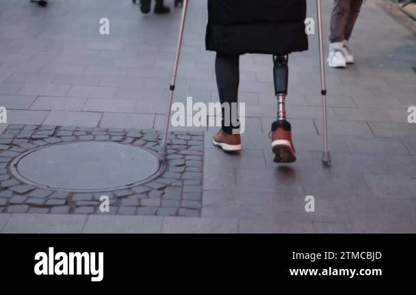 prosthetic leg, walking down, adaptive equipment. Close-up young ...