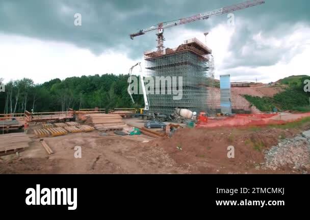 Road bridge support building site with construction tower crane ...