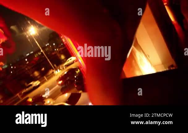 Sexy woman dancer go-go girl legs at night club window on Halloween ...