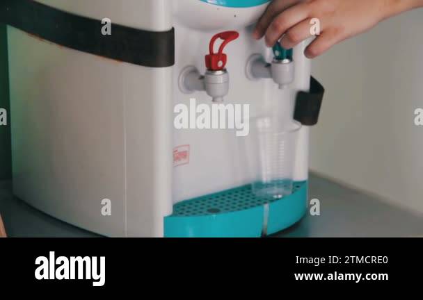 Filling cup water cooler dispenser Stock Videos & Footage - HD and 4K ...