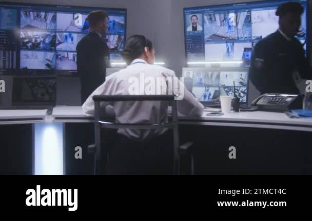 African American male operator in headset sits at workplace and ...