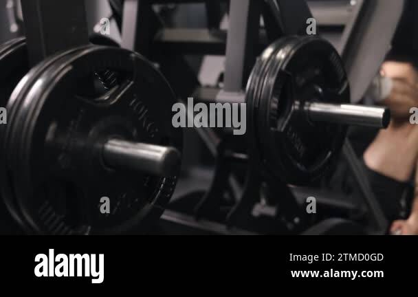 leg exercises, Fitness center, Leg press. Fitness instructor works out ...