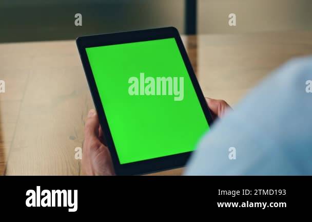 Employee hands holding mockup tablet at table closeup. Unrecognizable business man reading email ...