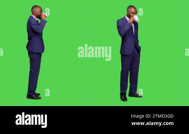 Company employee drinking coffee cup in studio, serving caffeine ...