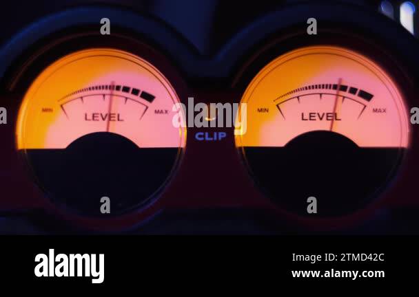 Two analog dial indicators of audio signal level. Vintage arrow moves ...