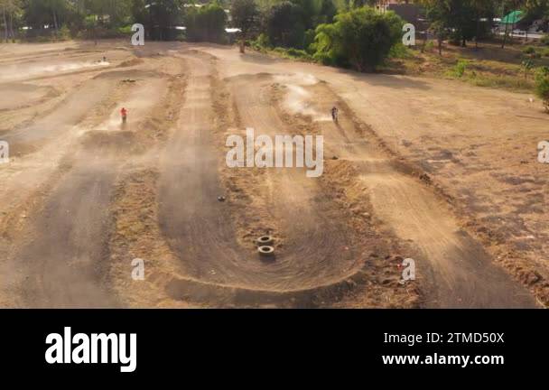 Aerial view of Motorcycle racers train on the motocross track, among ...