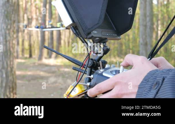 Man drone operator holding transmitter and operate by drone. 4K ...