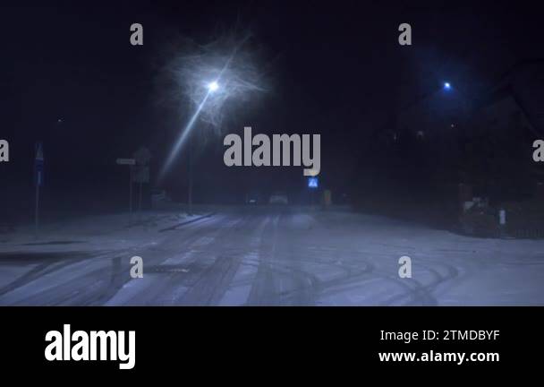 A view of the street from the drivers perspective. Bad weather ...