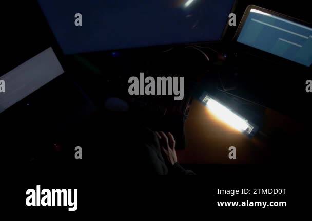Hacker In Hood Cracking Code Using Computers In Dark Room Stock Video 1851
