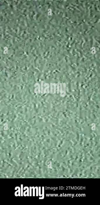 Vertical video. Glitch grain. Old film static noise. Green black real ...