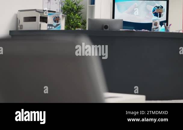 Empty front desk in medical clinic, facility reception counter with ...