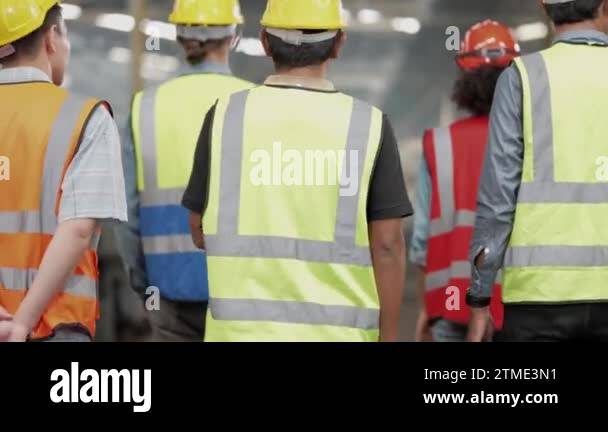 engineers meeting. factory worker people walk and check in warehouse ...